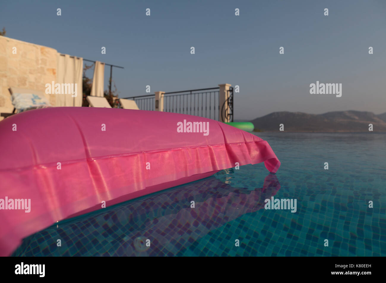 Lie Low and floating rings in swimming pool Stock Photo - Alamy