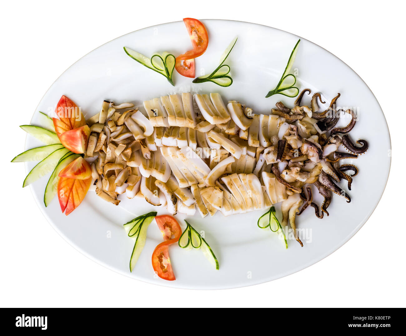 Plate of grilled squids - isolated on white background. Studio Shot ...