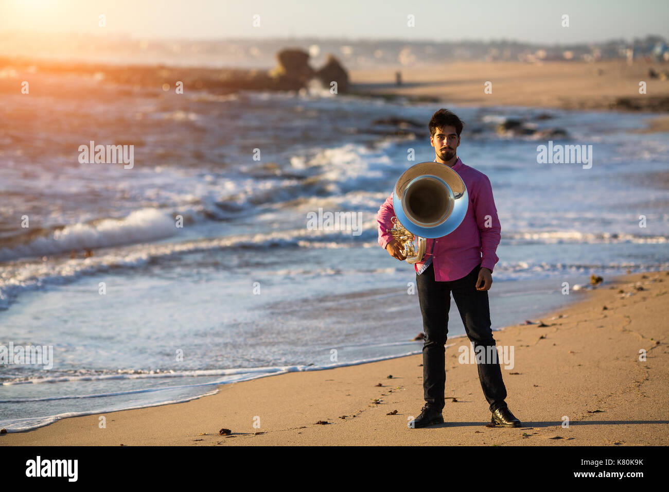 Man musician playing the Tuba on the sea coast Stock Photo - Alamy