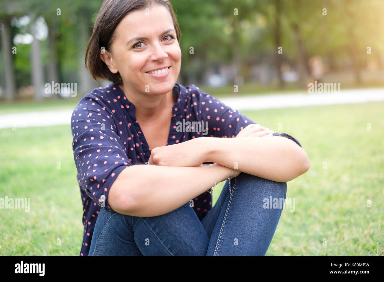 Woman sit nature grass hi-res stock photography and images - Alamy