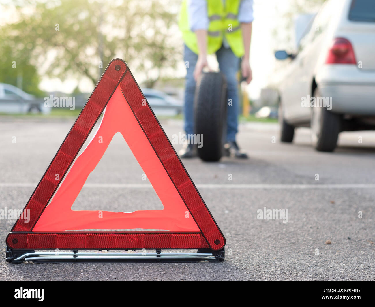 Person Changing Flat Tyre High Resolution Stock Photography and Images ...