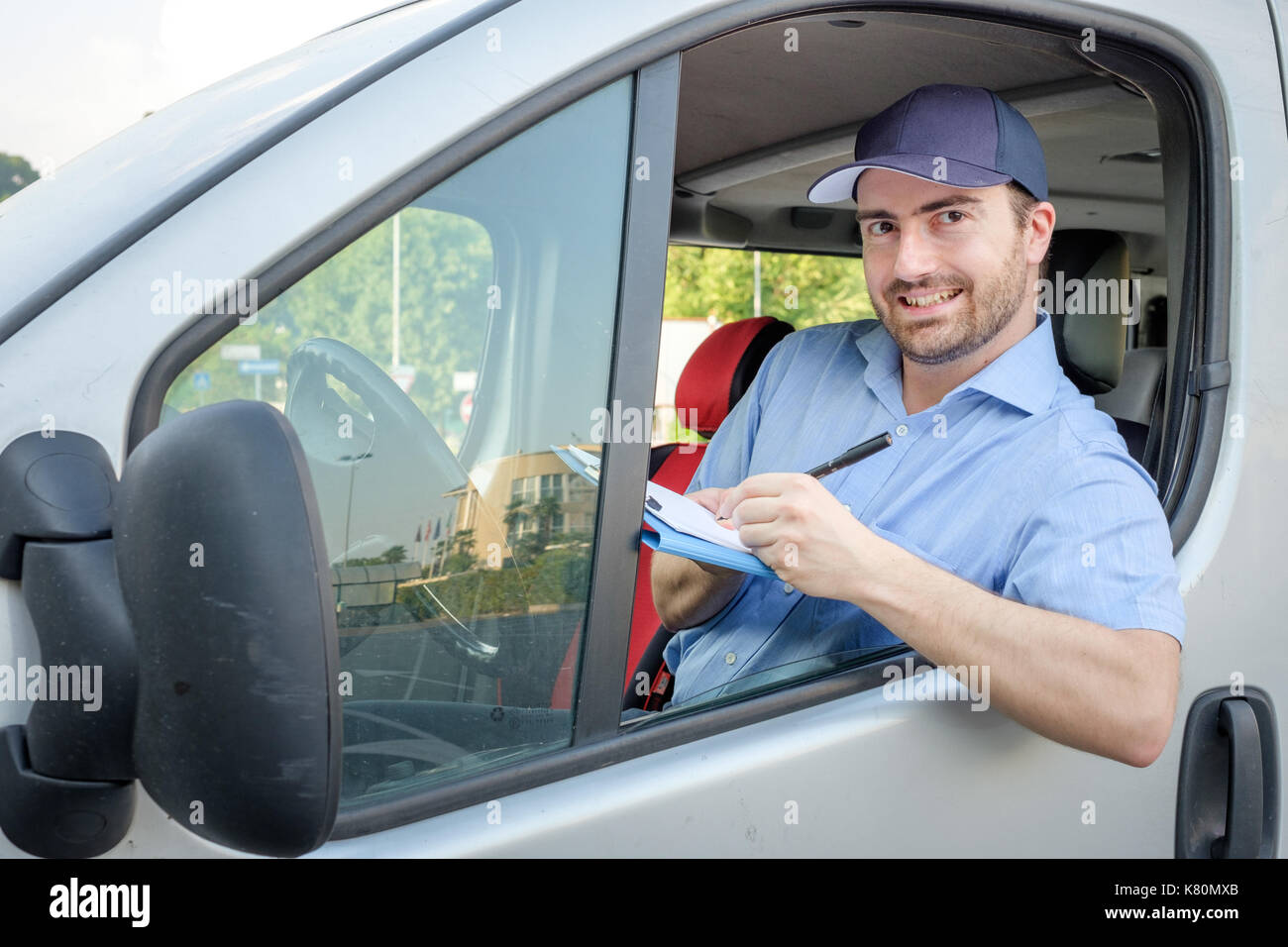 Postal worker driving truck hi-res stock photography and images - Alamy