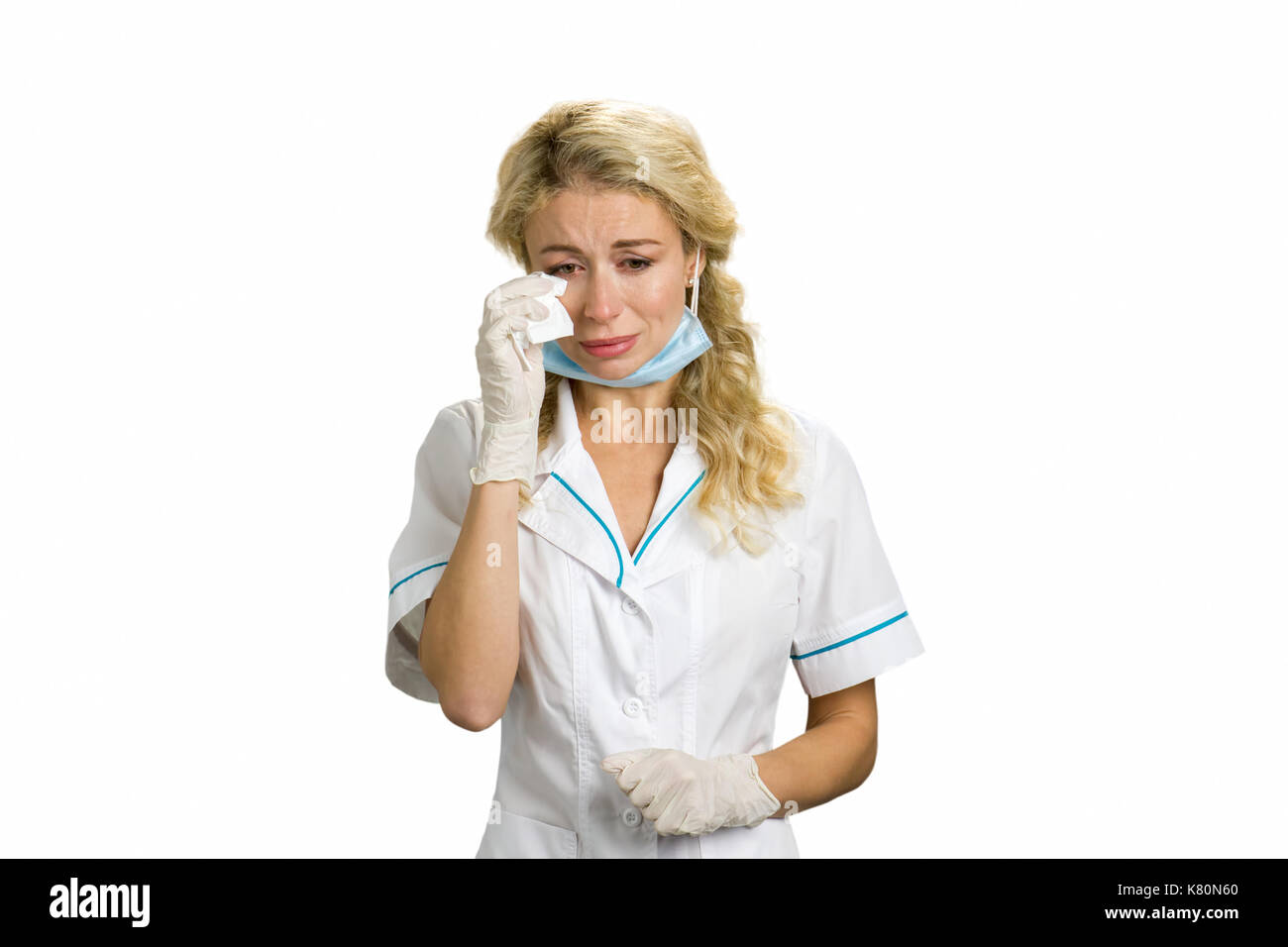 Crying female doctor, white background Stock Photo - Alamy