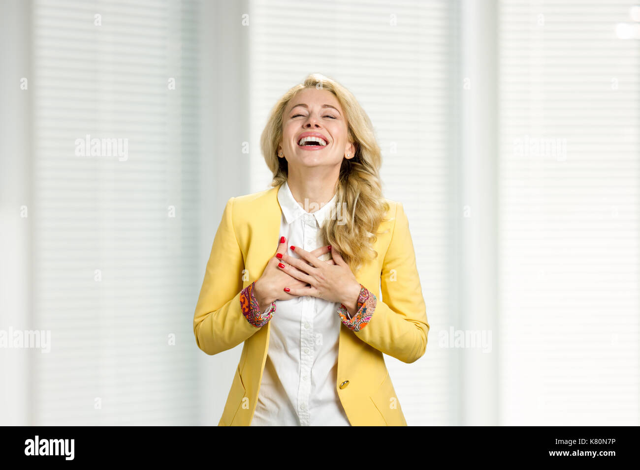 Young beautiful blond laughing Stock Photo - Alamy