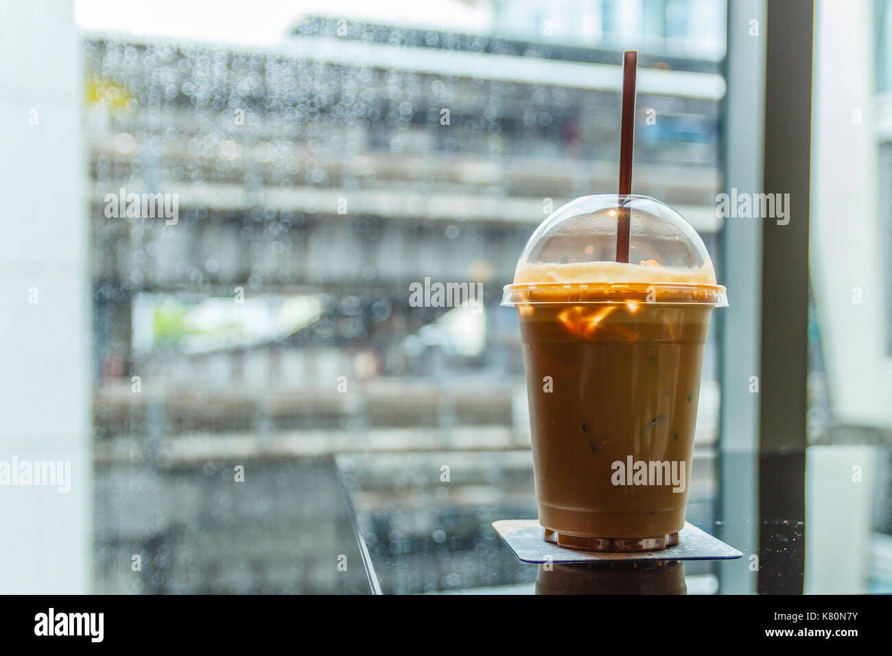 A cup of cold coffee in rainy day Stock Photo - Alamy