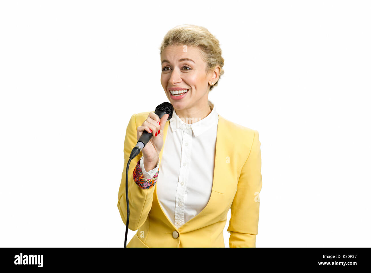 Young person speaking into microphone hi-res stock photography and ...