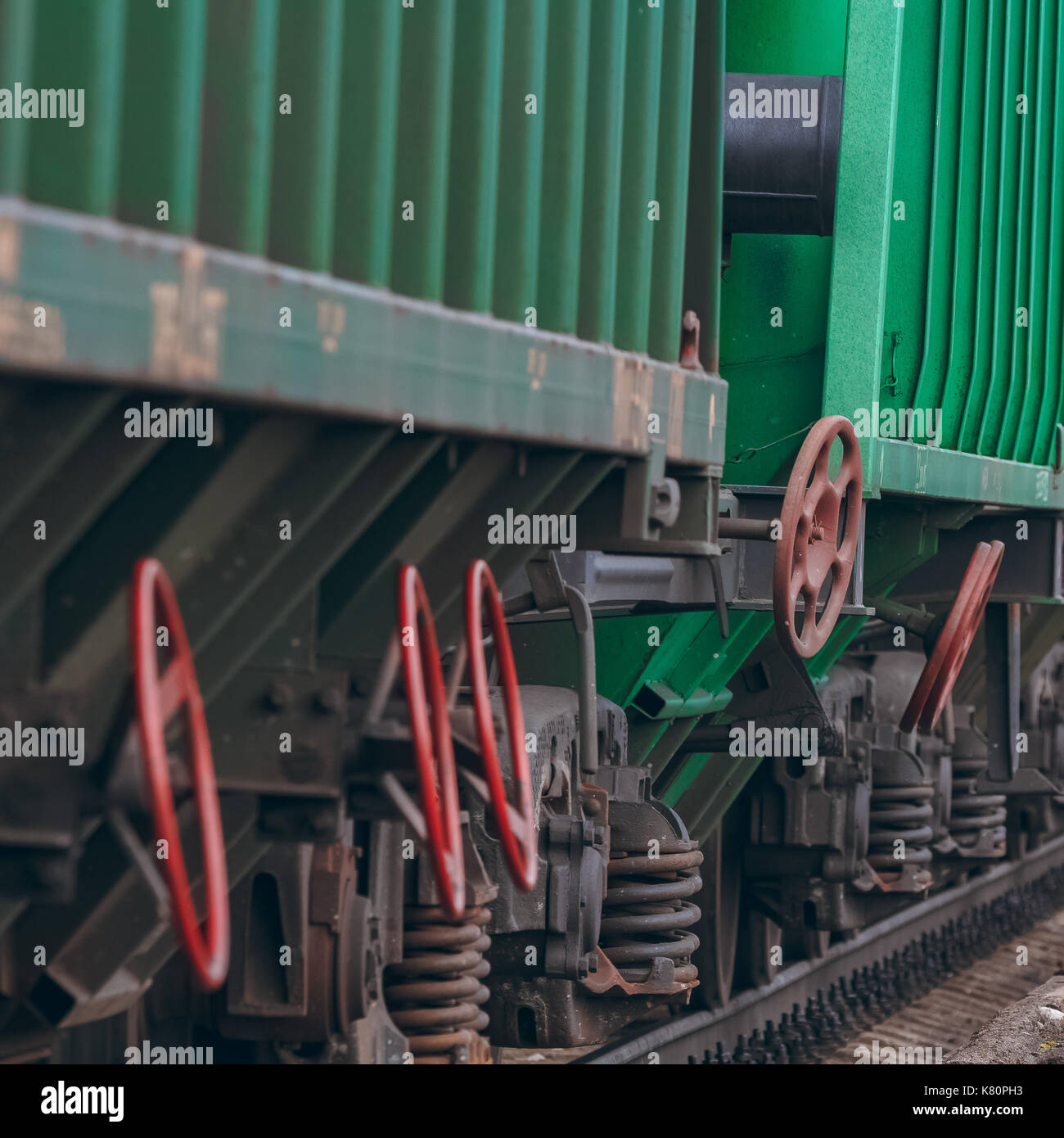 Green cargo wagons. Freight train in action Stock Photo - Alamy