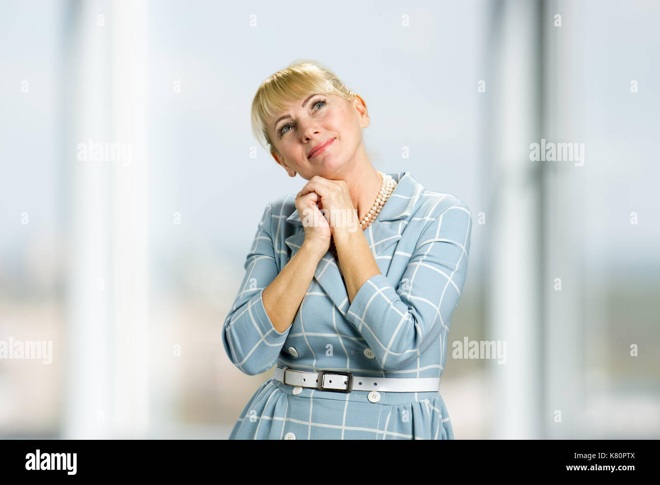 Portrait of thoughtful smiling woman Stock Photo - Alamy