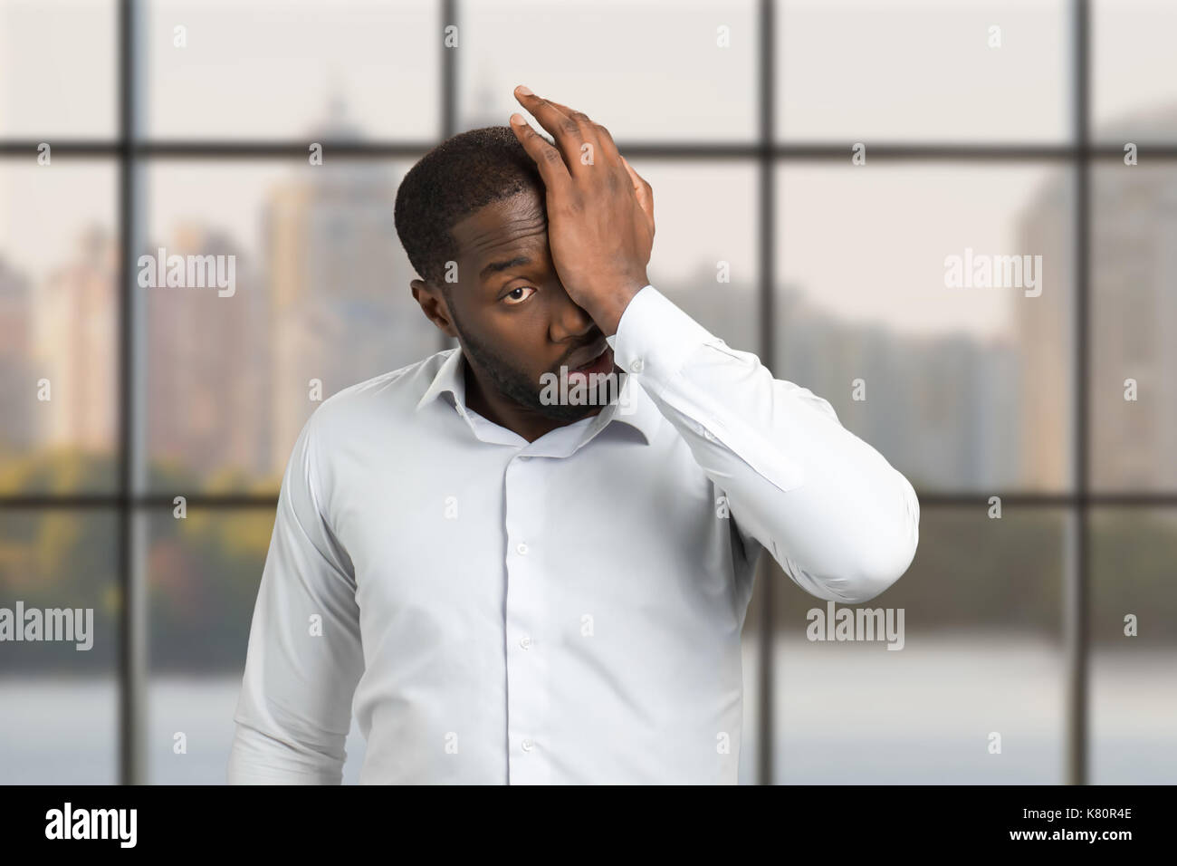 Businessman hold hand on eye Stock Photo - Alamy
