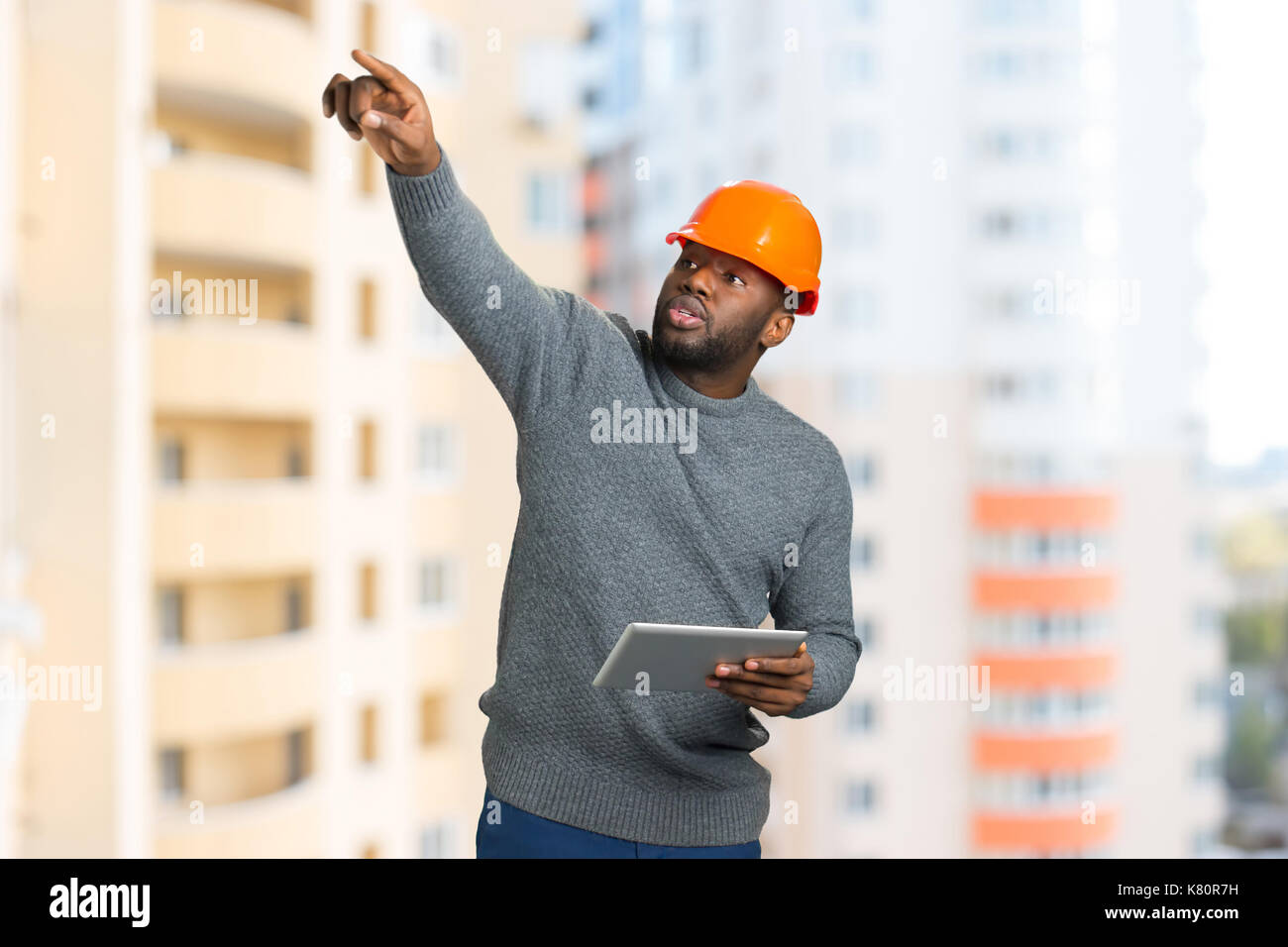 Construction supervisor on building background Stock Photo - Alamy