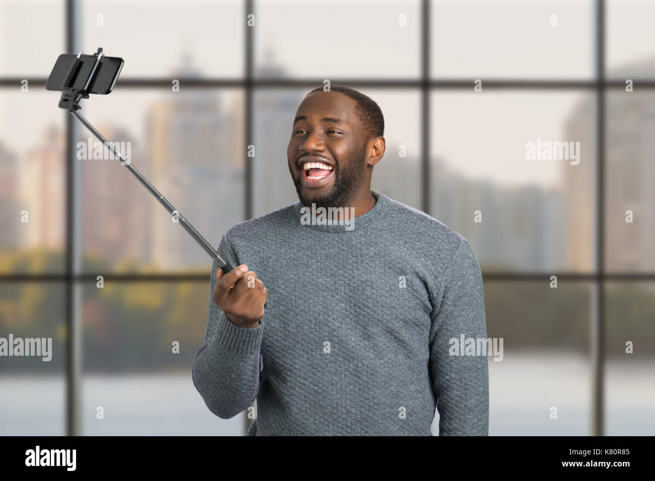 Joyful handsome guy laughing hi-res stock photography and images - Alamy