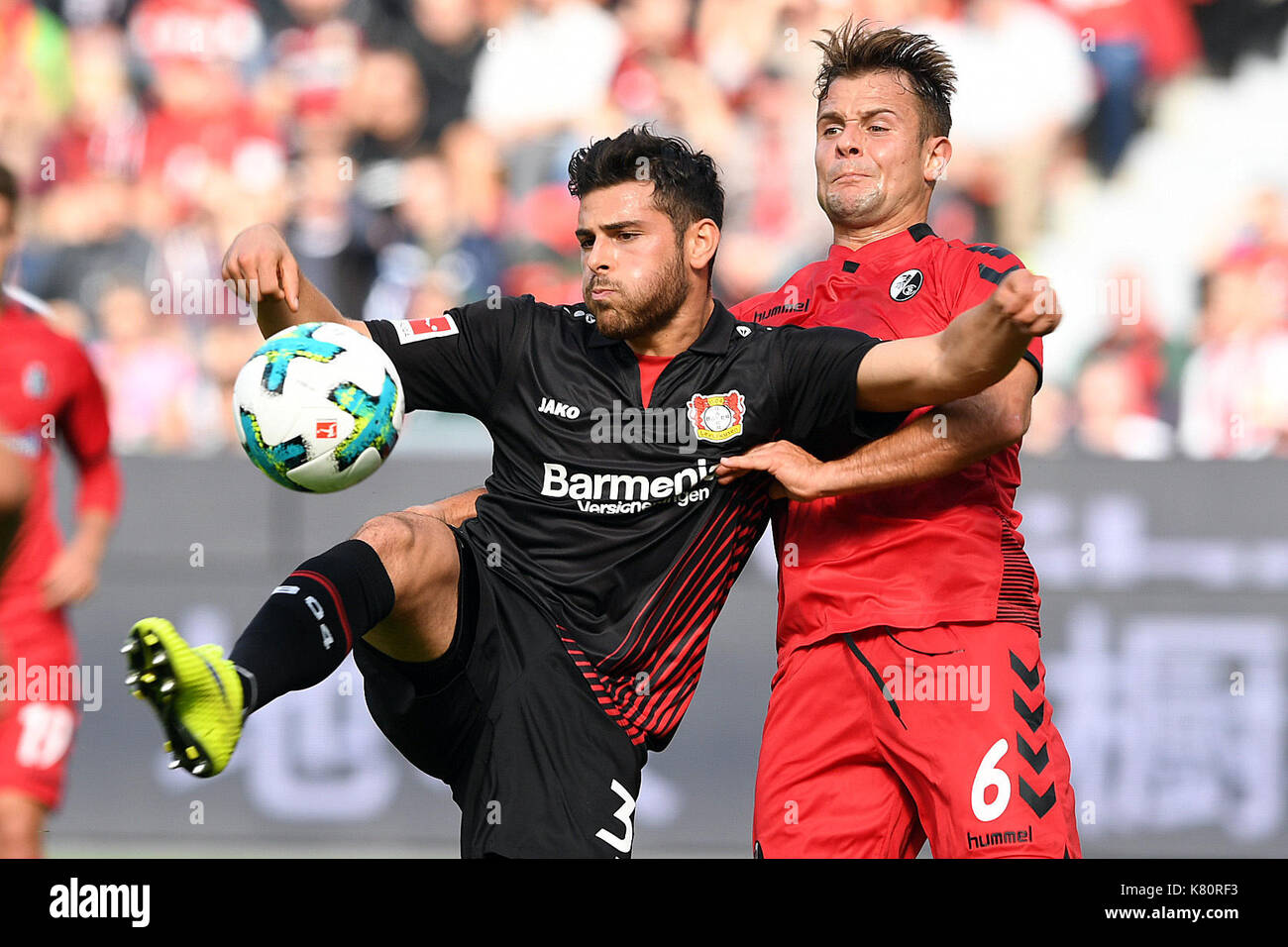 Leverkusen, Germany. 17th Sep, 2017. Leverkusen's Kevin Volland (L) and ...