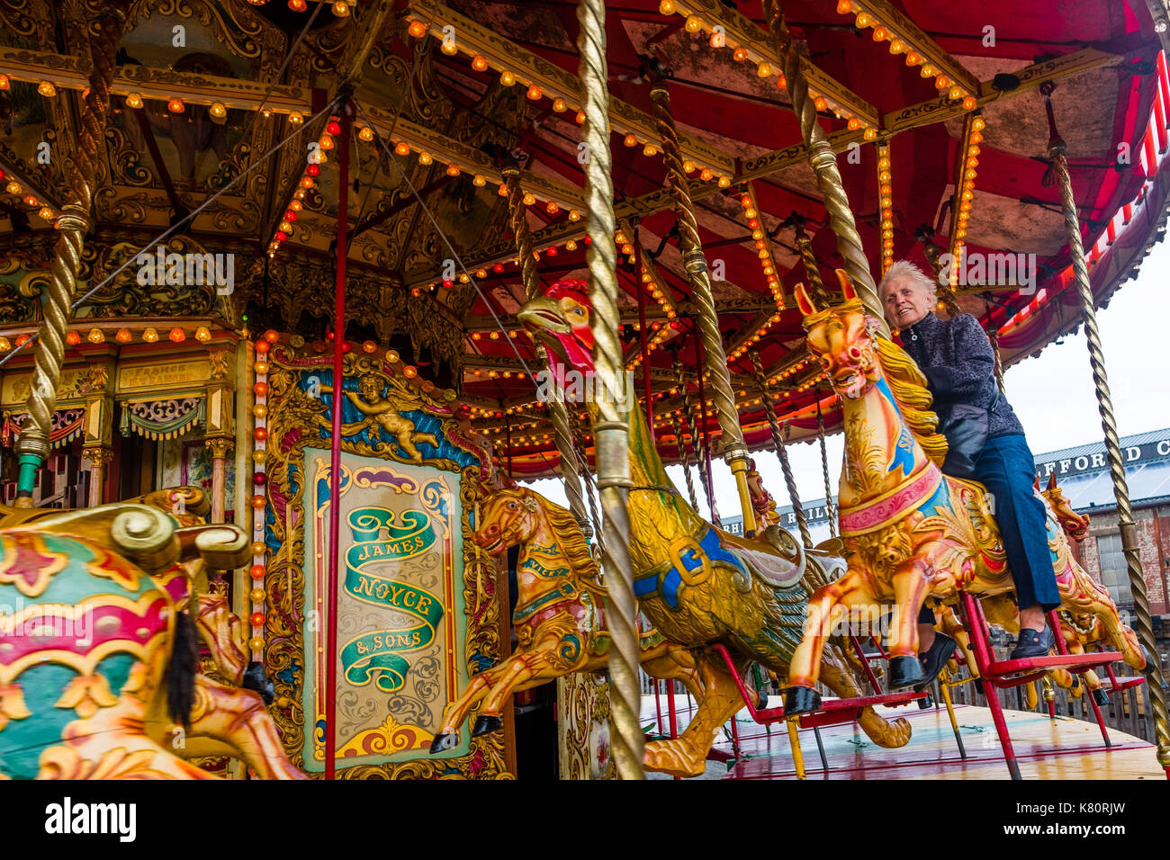 Woman riding carousel horse hi-res stock photography and images - Alamy
