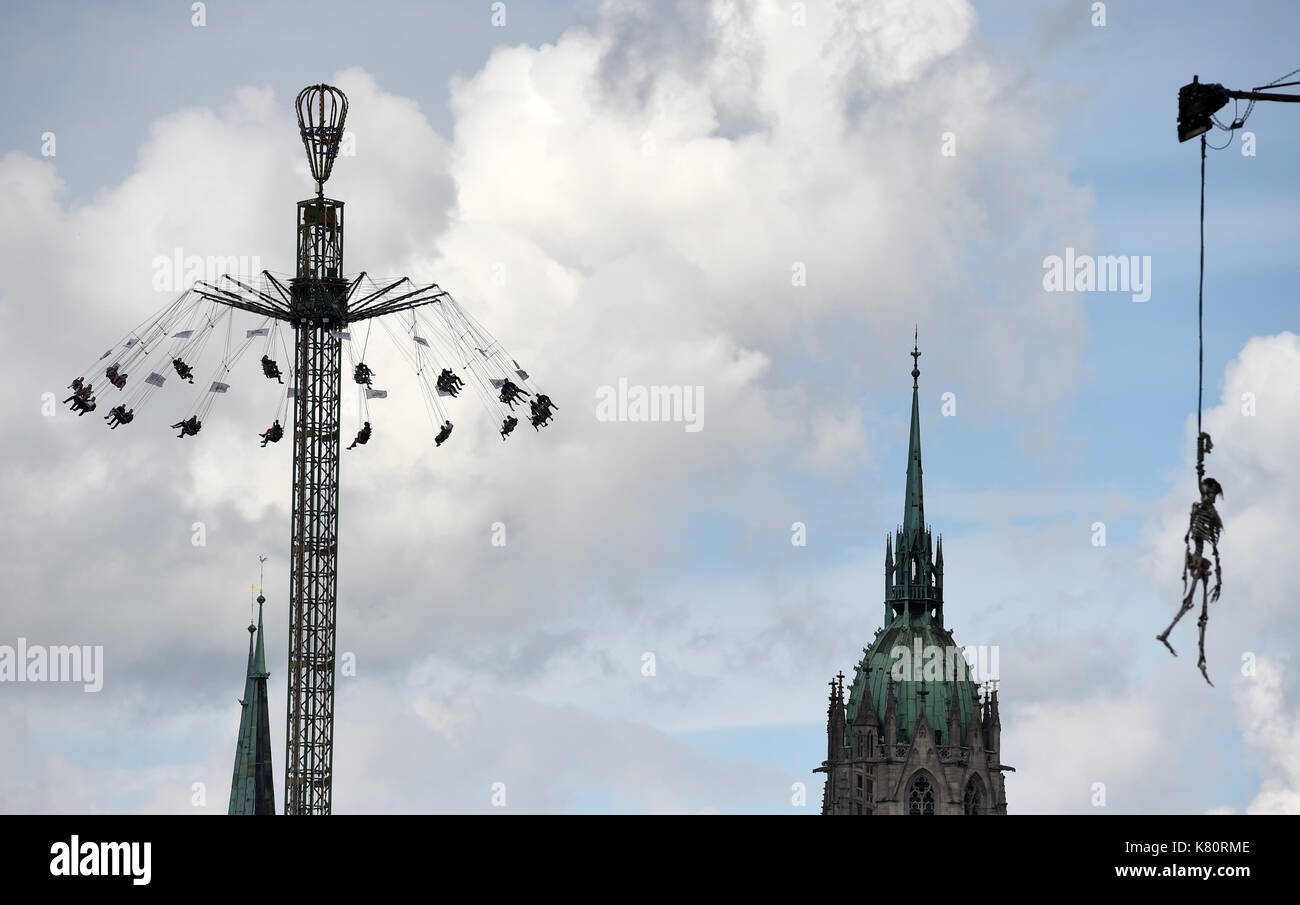 Munich, Germany. 17th Sep, 2017. Visitors enjoy a fairground ride at ...