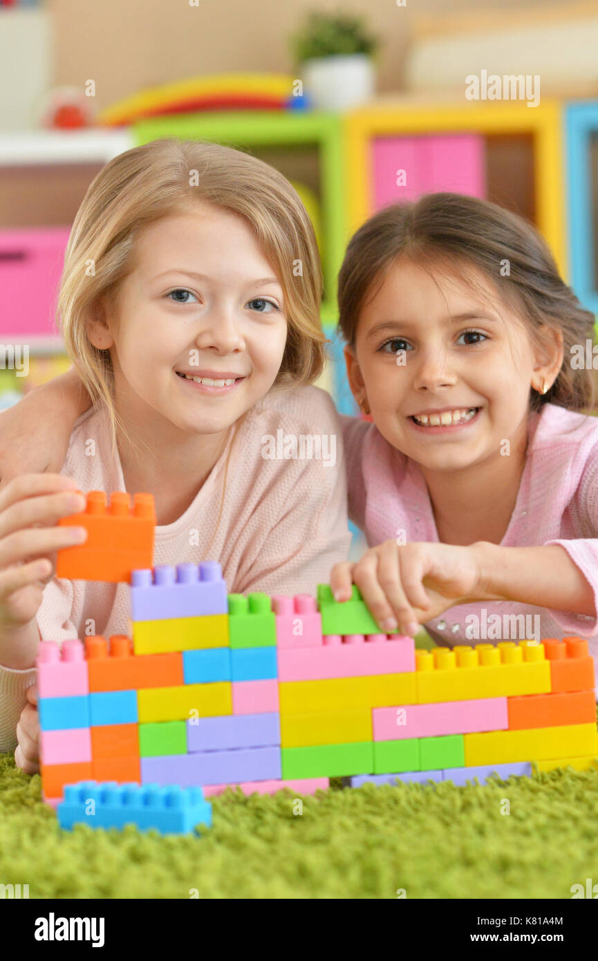 girls playing with colorful blocks Stock Photo - Alamy