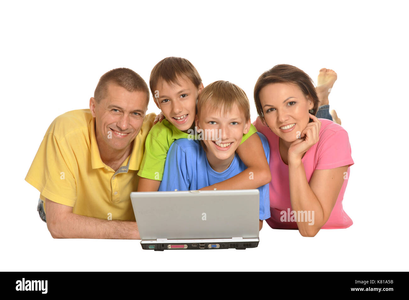 Parents with sons using laptop Stock Photo - Alamy