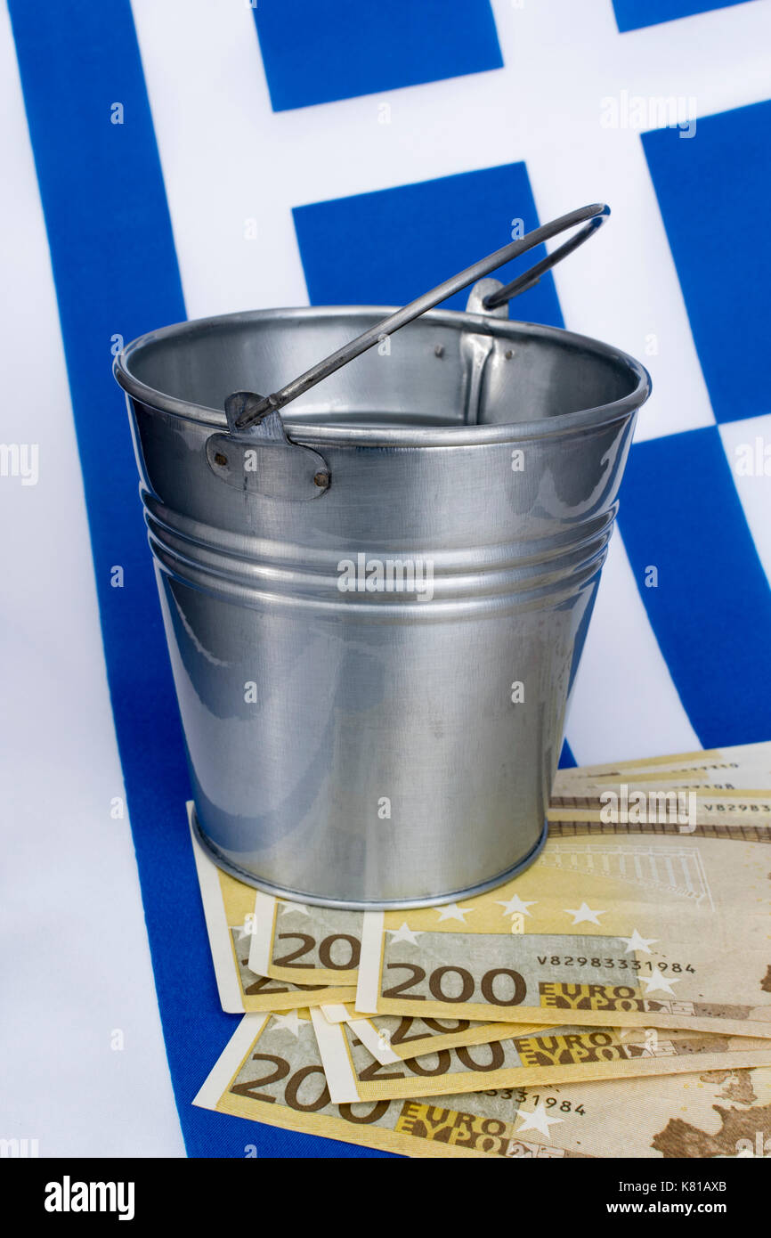 Greek flag with a metal bucket of 200 Euro banknotes. For Greek ...