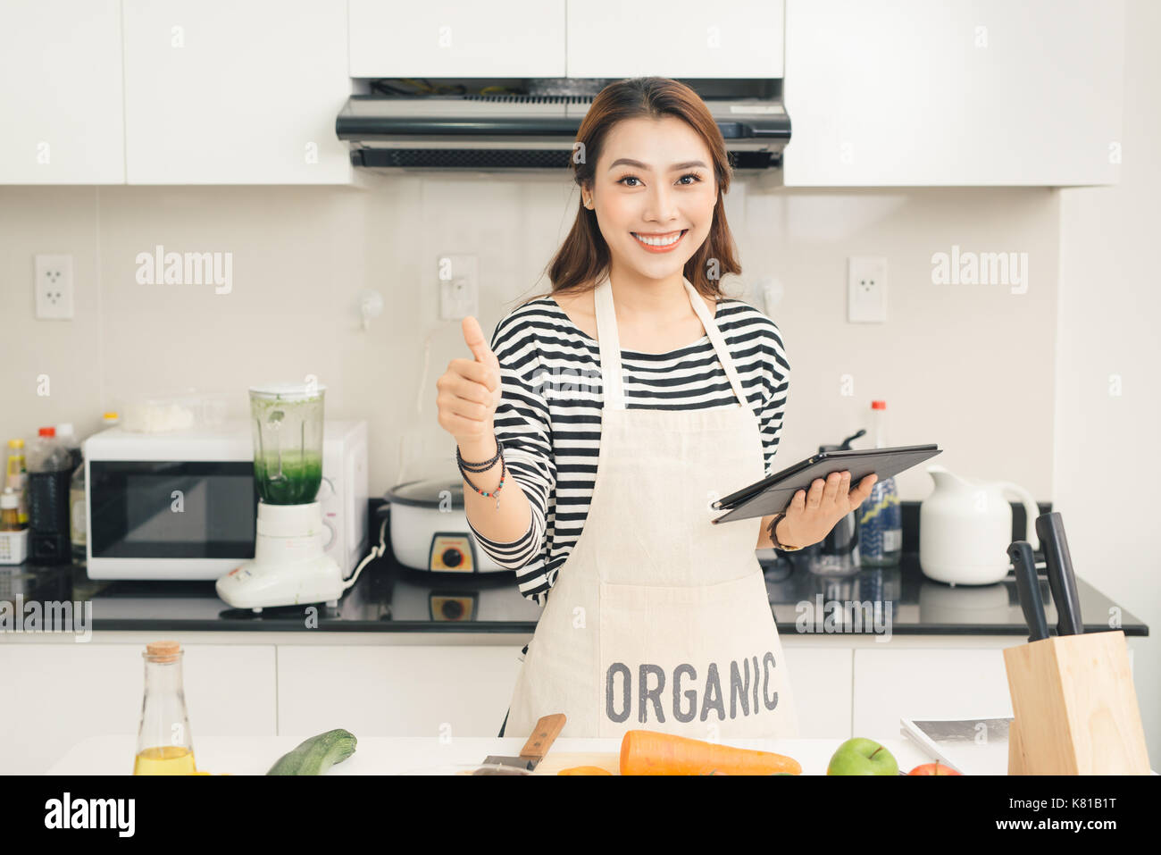 Beautiful lady cooking in kitchen hi-res stock photography and images ...