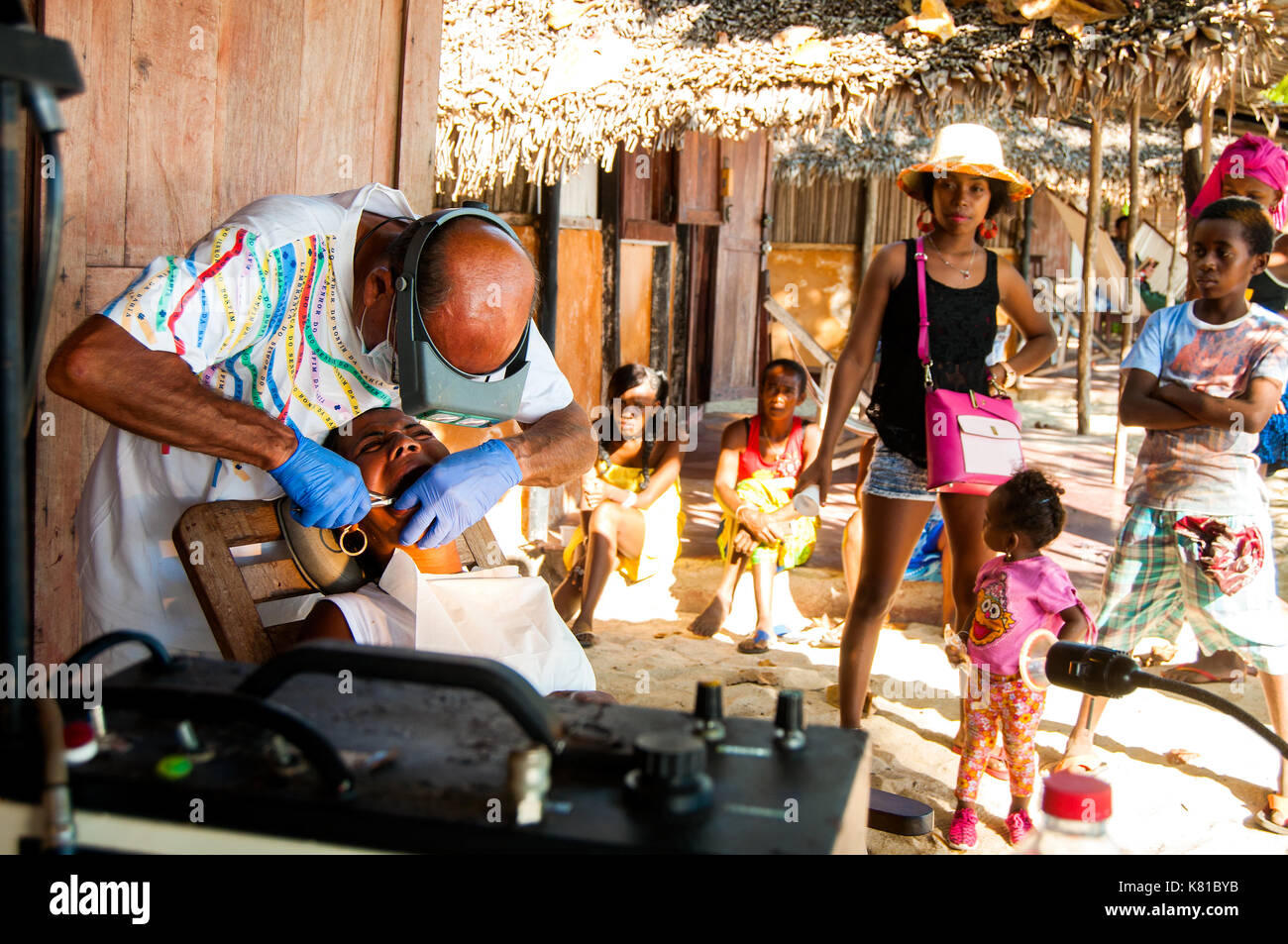 Volunteer Italian dentist at work with local Malagasy patients on his ...