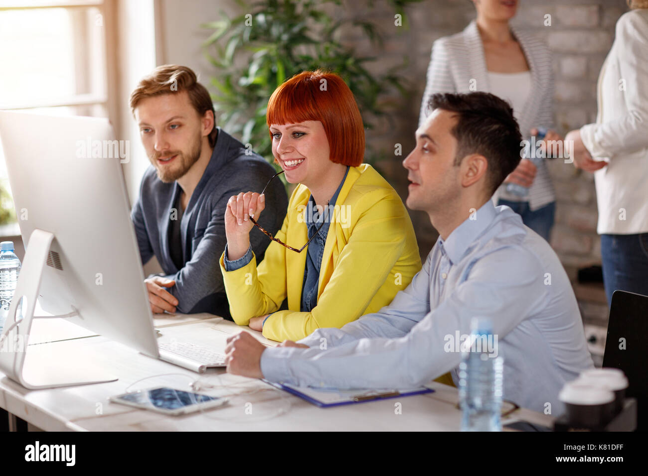 Young urban business team in office Stock Photo - Alamy