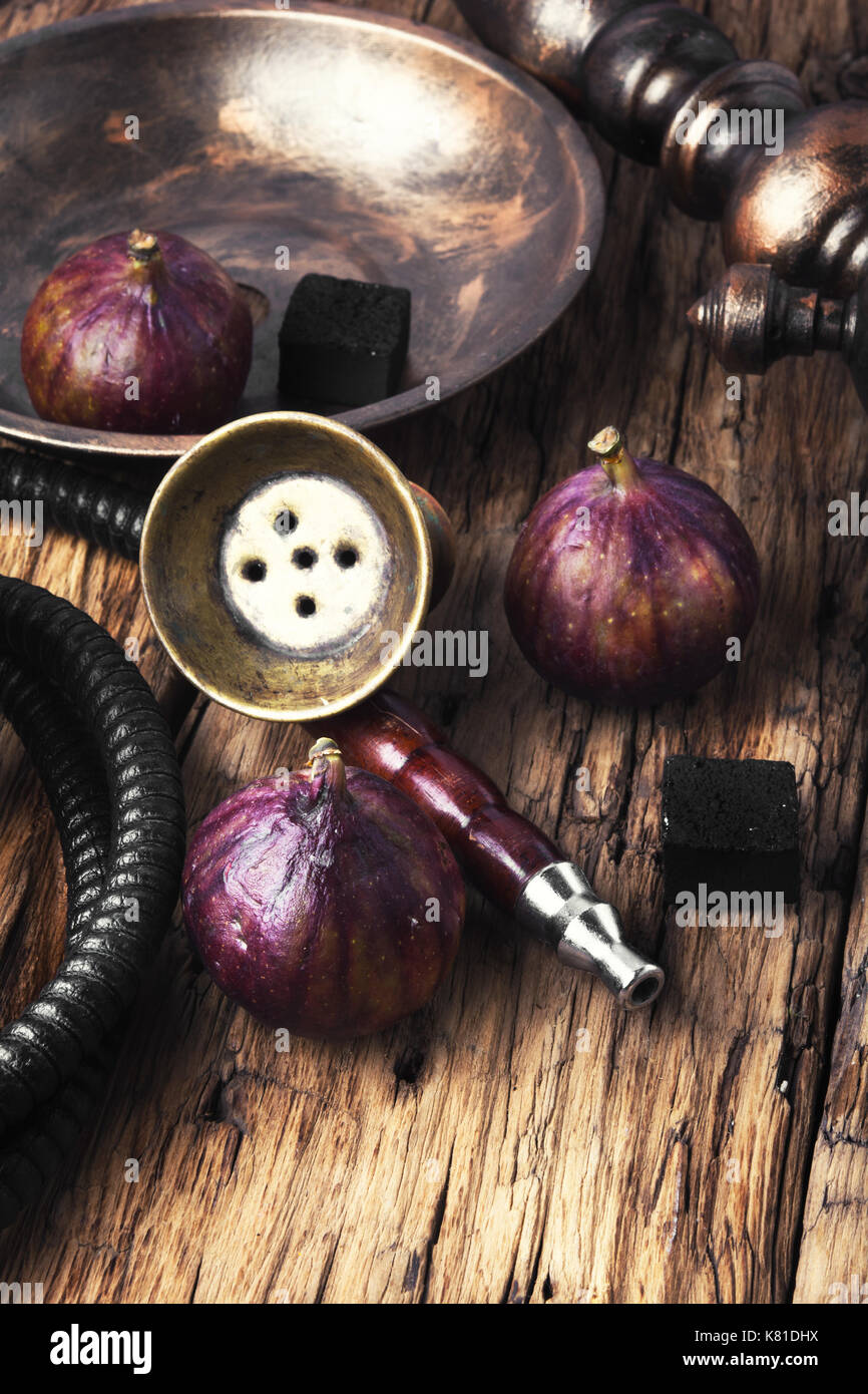 Exotic smoked shisha with tobacco with a taste of fig fruit Stock Photo ...