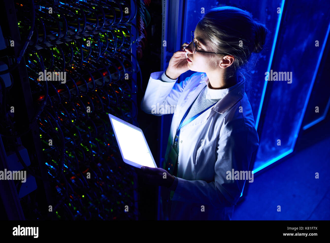 High angle portrait of beautiful female scientist working with ...