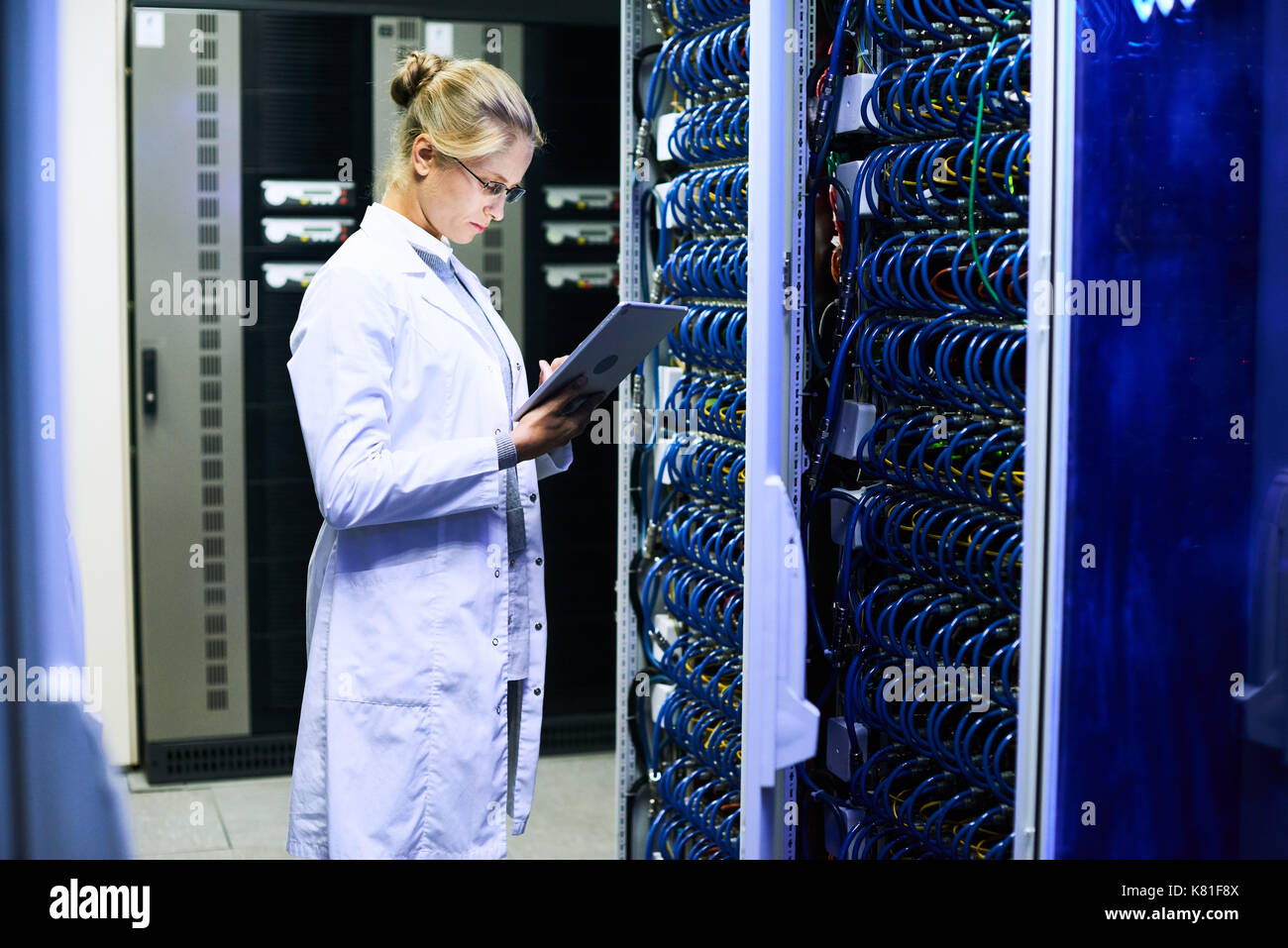 Female Scientist Working with Supercomputer Stock Photo - Alamy