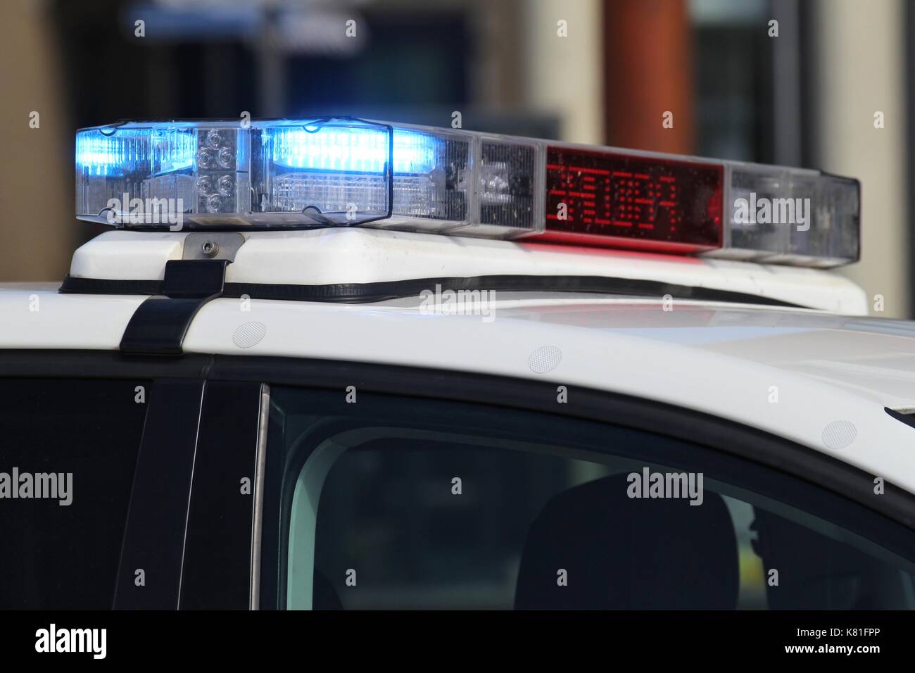 Police car with lights flashing hi-res stock photography and images - Alamy
