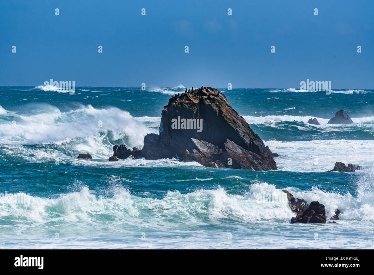 Waves crash against the rocks along the Alaskan Coast Stock Photo - Alamy
