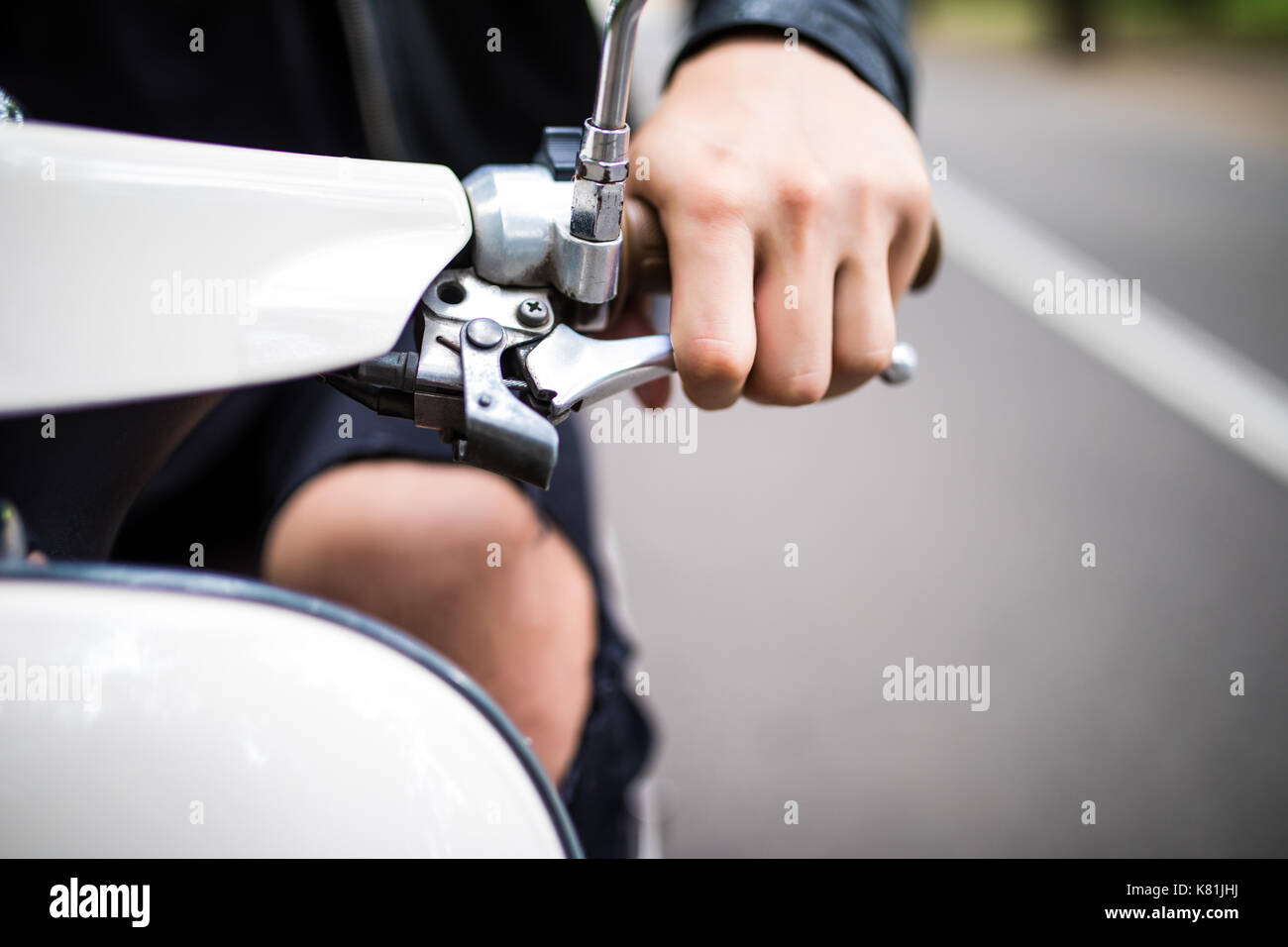 Riding motorcycle, close up of hand on handlebar Stock Photo - Alamy