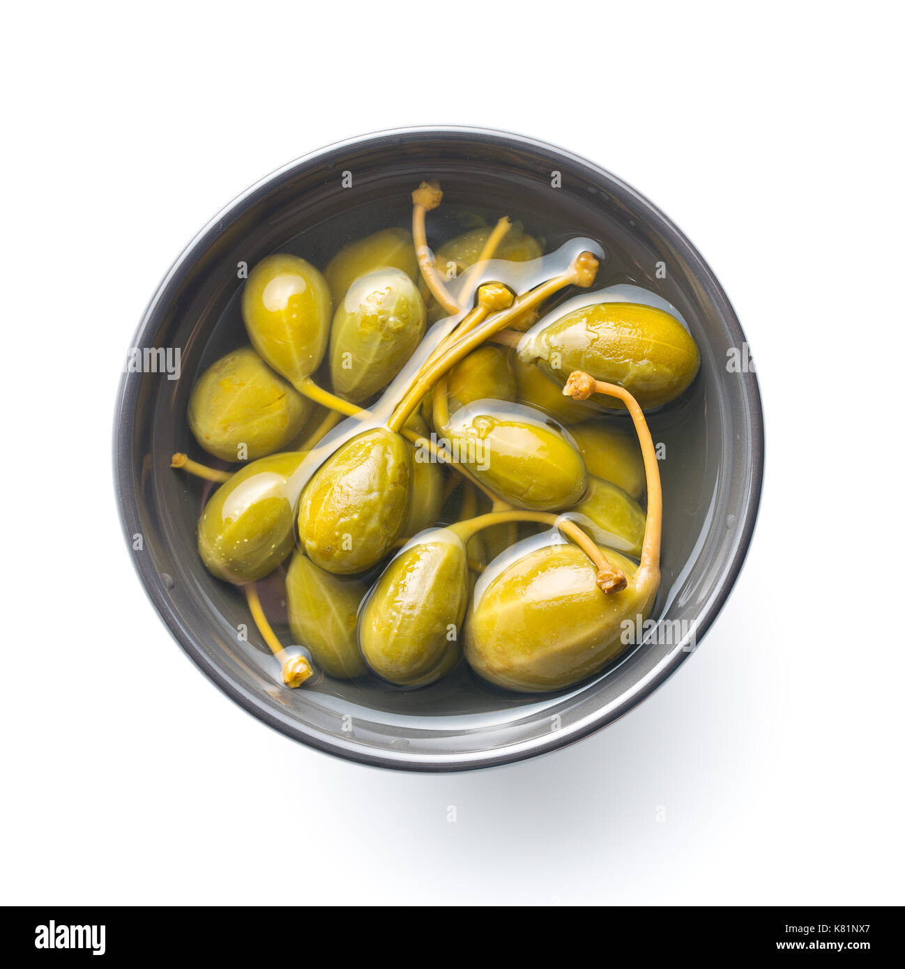Pickled caper berries in bowl isolated on white background Stock Photo ...