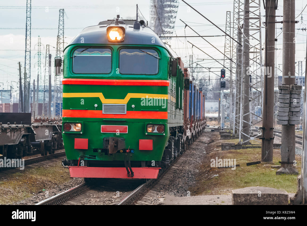 Green diesel cargo locomotive. Freight train in action Stock Photo - Alamy