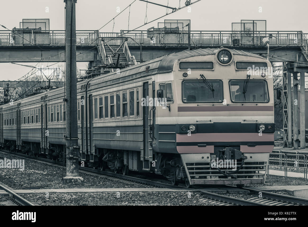 Old passenger electric train riding at the terminal Stock Photo - Alamy