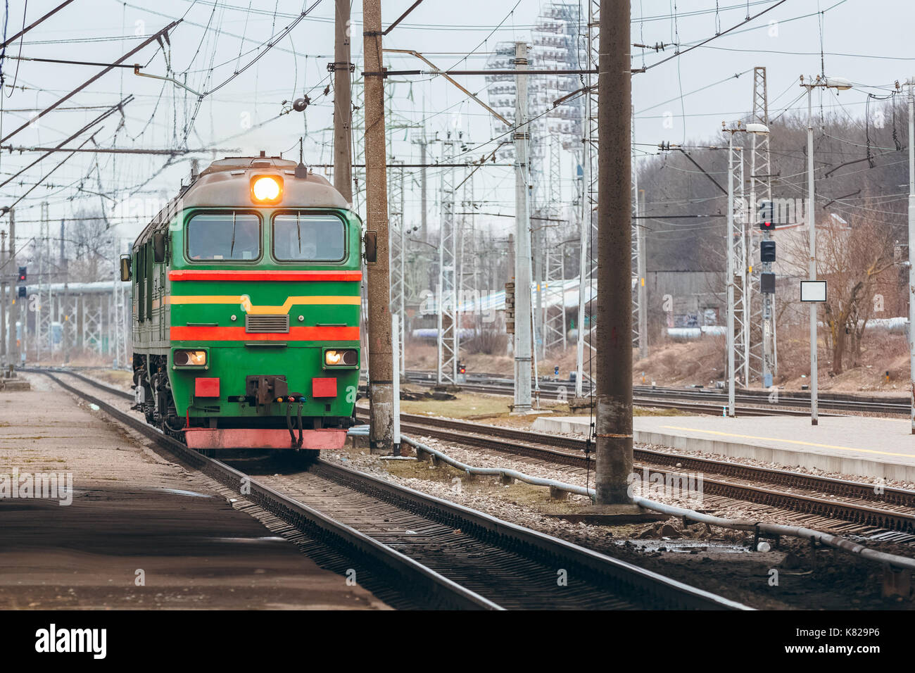 Green diesel cargo locomotive. Freight train in action Stock Photo - Alamy