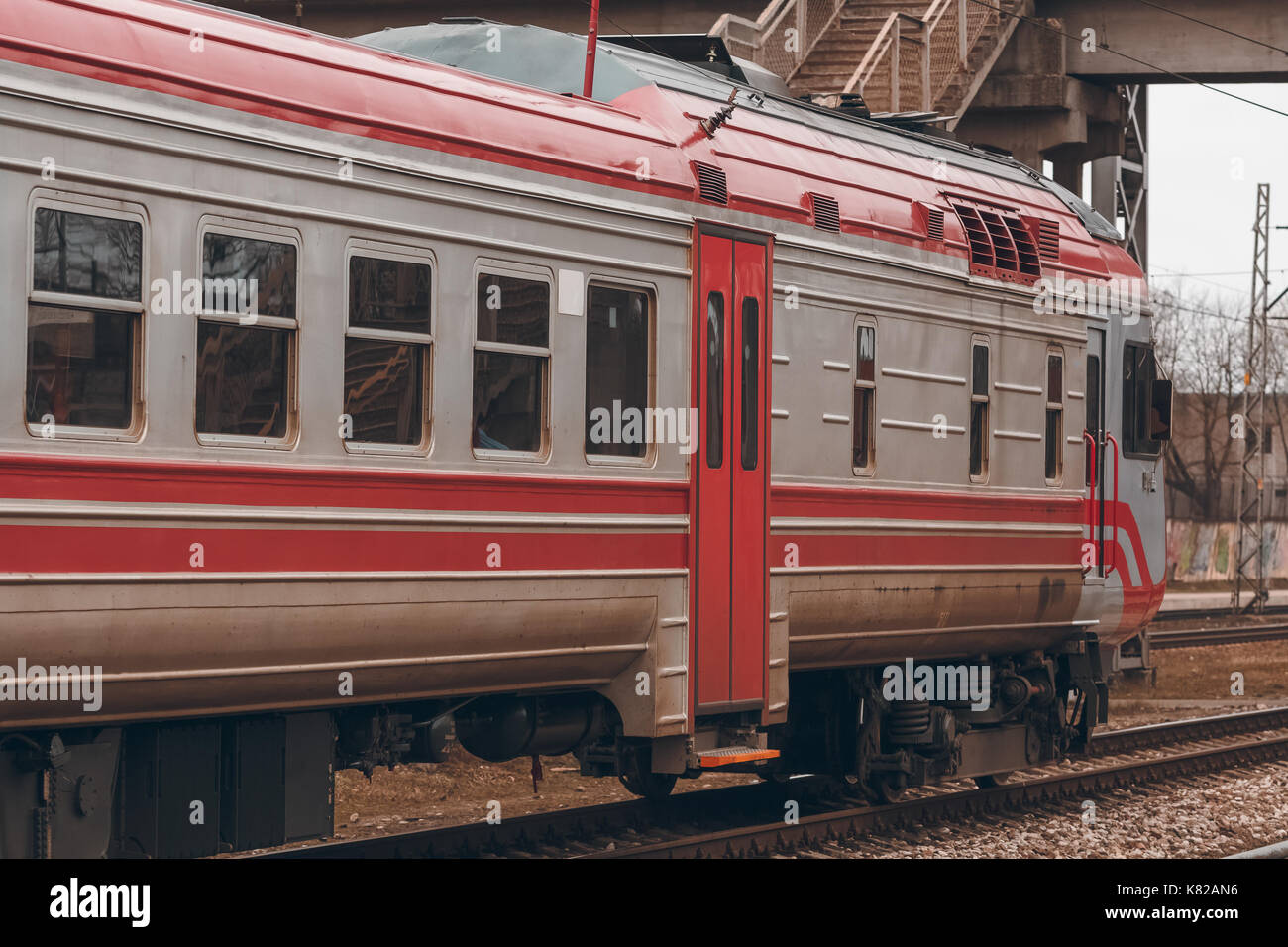 Red diesel passenger train driving at the old terminal Stock Photo - Alamy