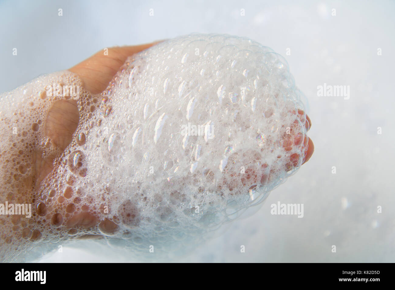 bubble foam in hand Stock Photo - Alamy