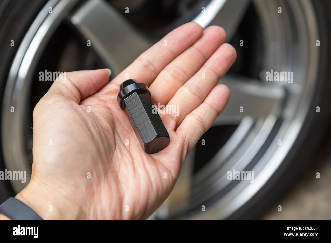 wheel nut of car in hand Stock Photo - Alamy