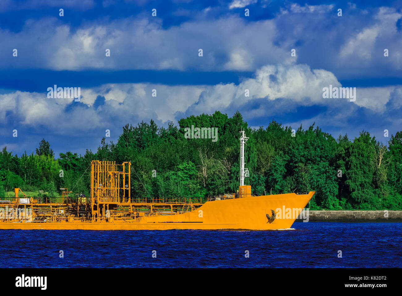 Yellow cargo tanker ship moving at the clear summer day Stock Photo - Alamy