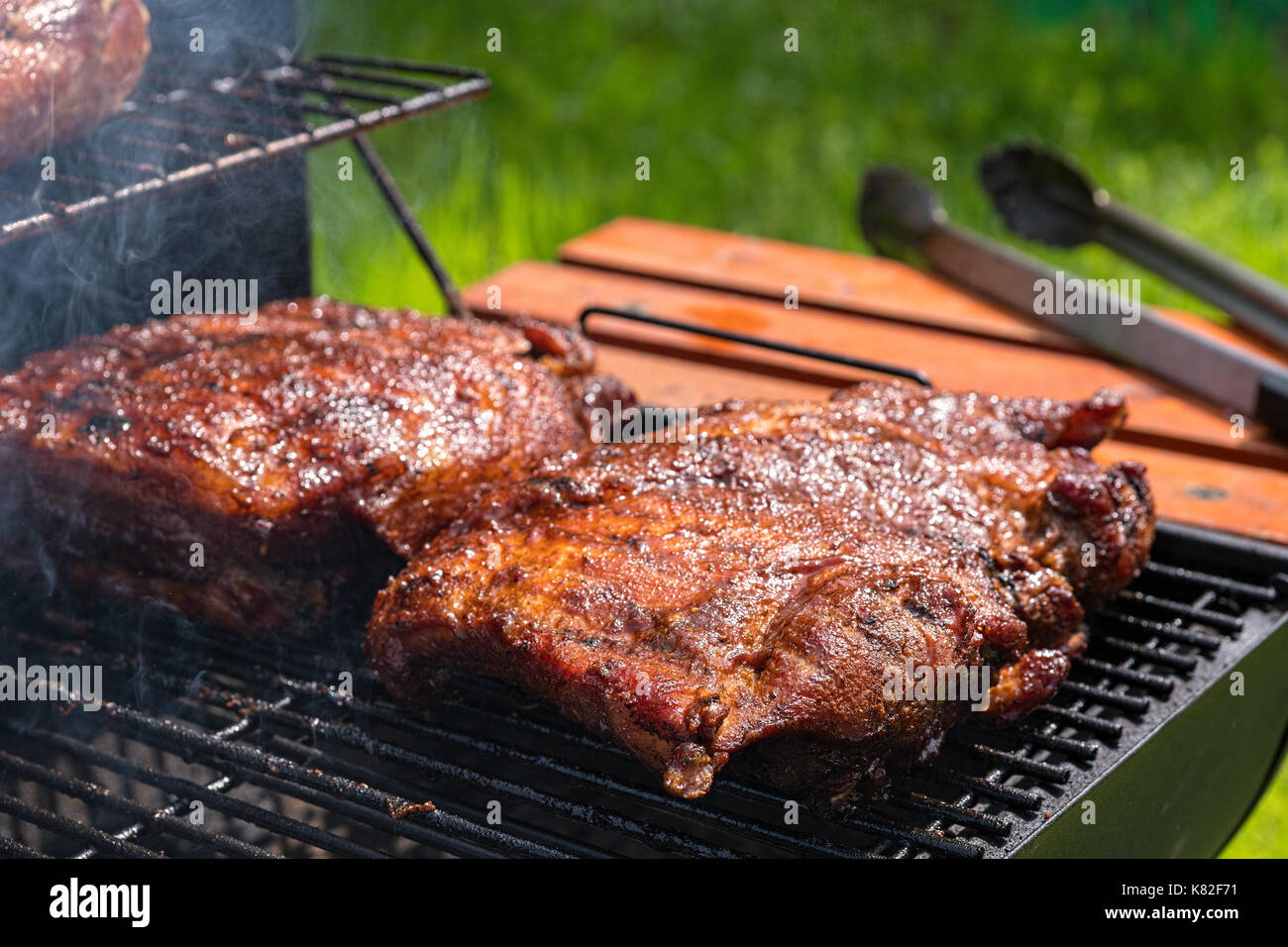 Grilled pork ribs on the grill barbecue Stock Photo - Alamy