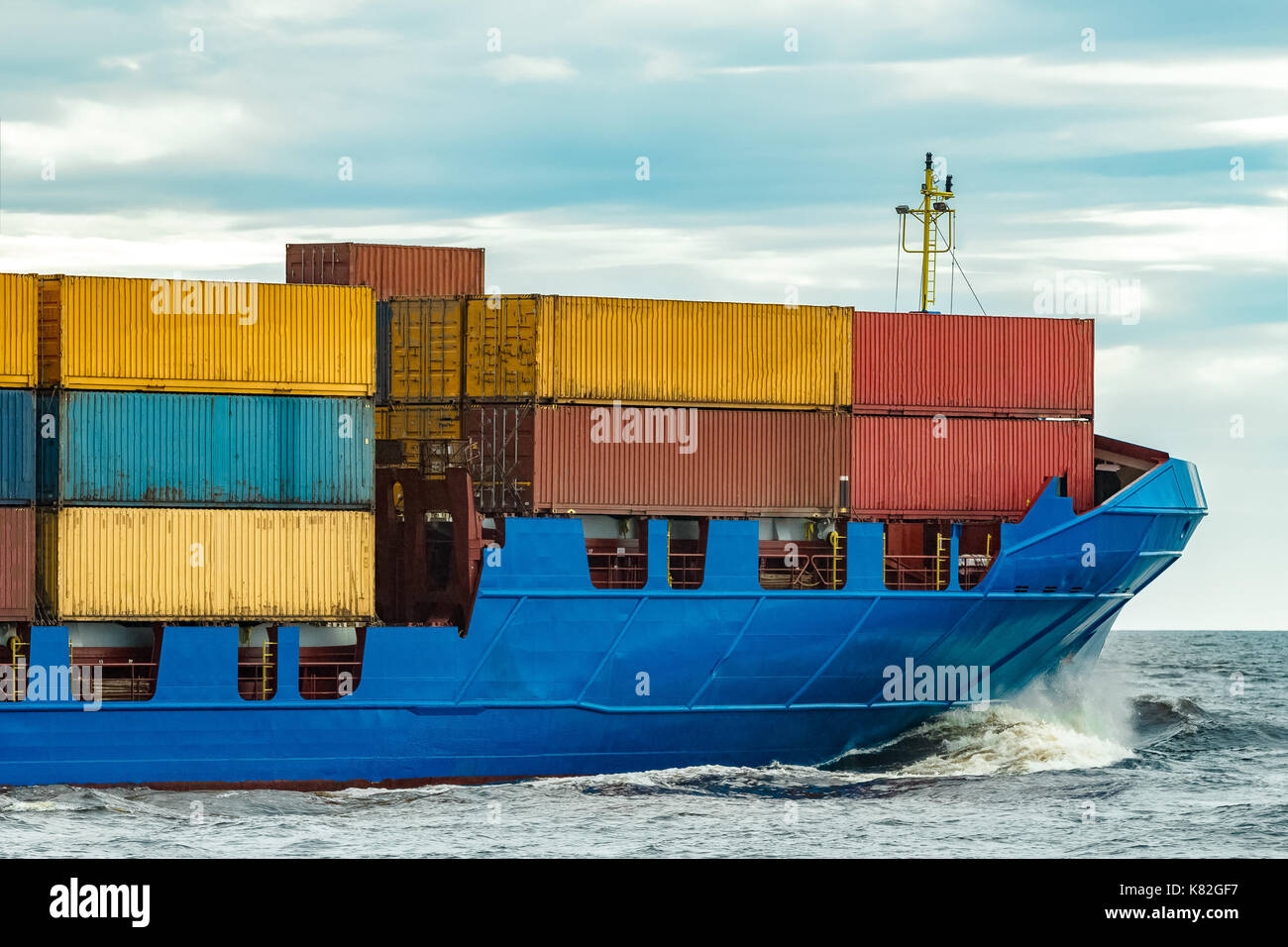 Blue cargo container ship fully loaded underway Stock Photo - Alamy