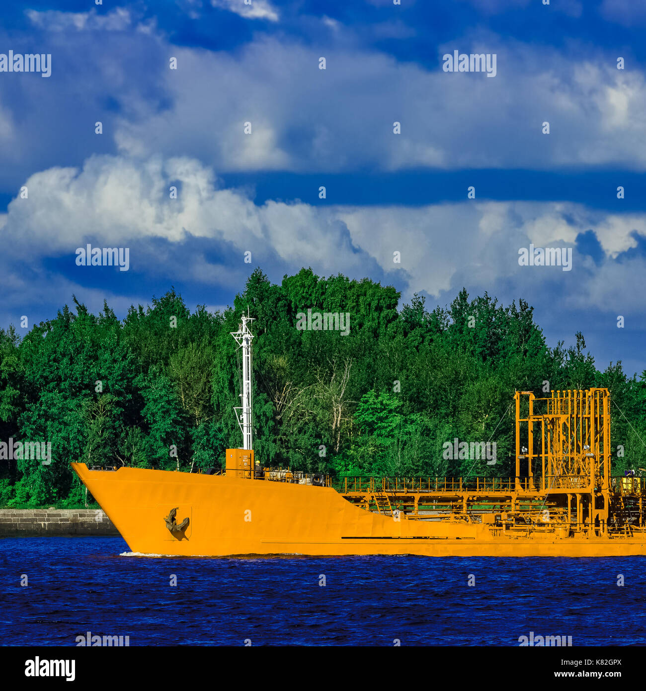 Yellow cargo tanker ship moving at the clear summer day Stock Photo - Alamy