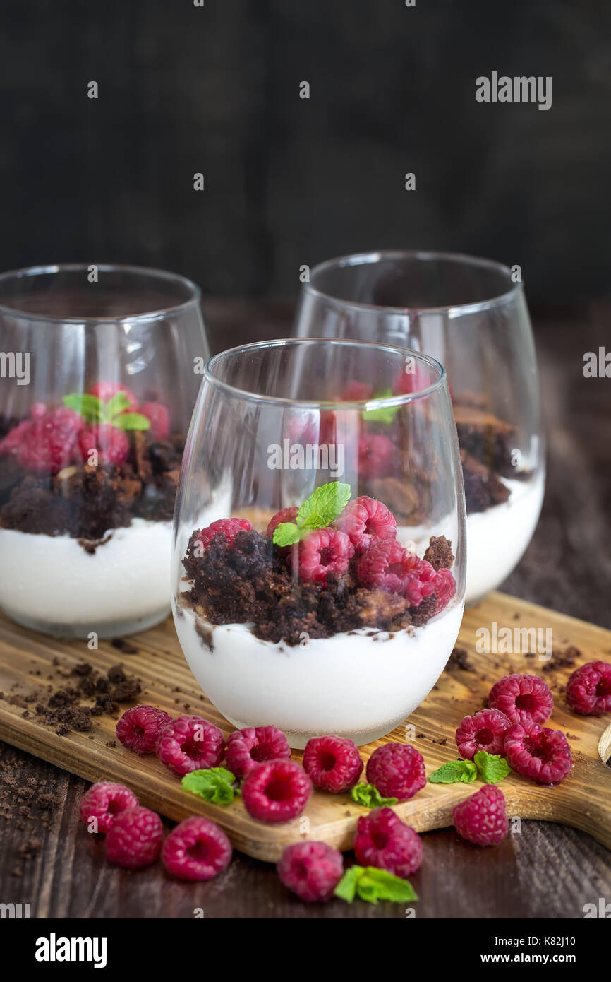 Raspberry and chocolate trifle desert on wooden background Stock Photo ...