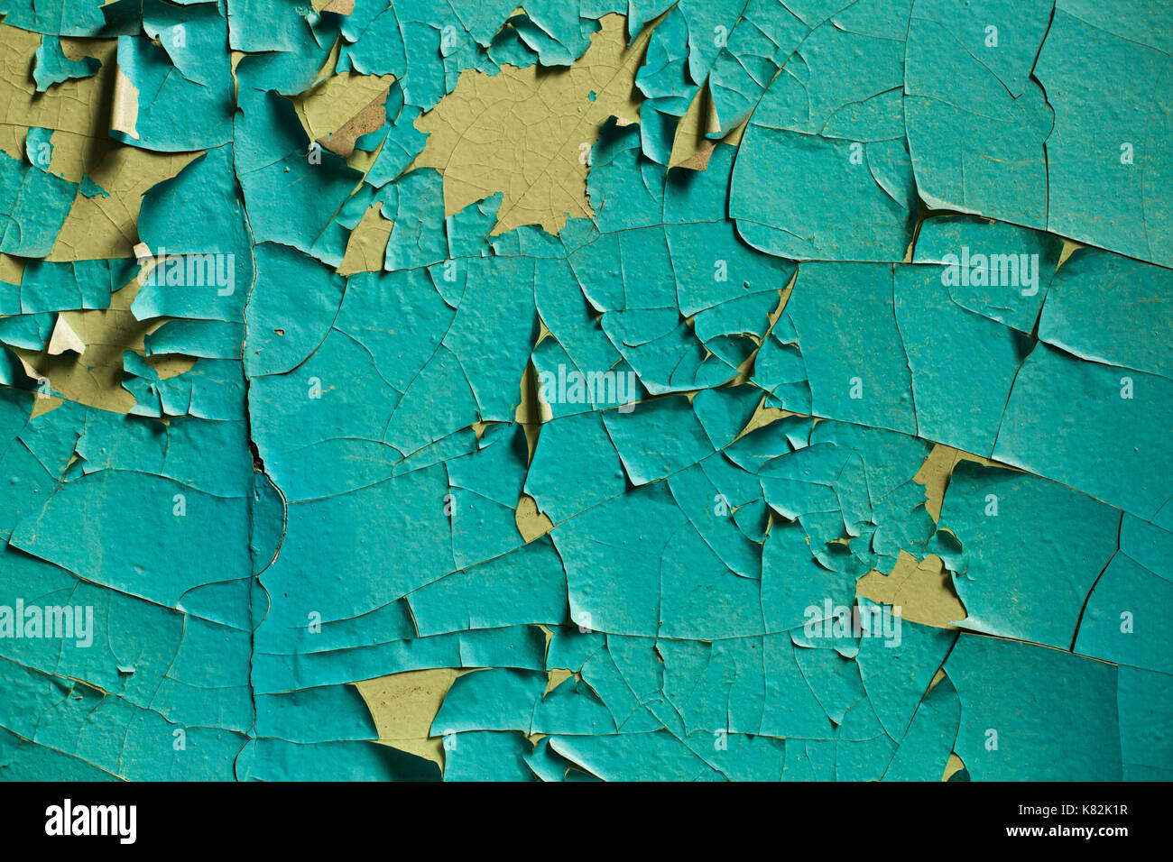 Cracked wall with old layers of paint in abandoned house. Background ...