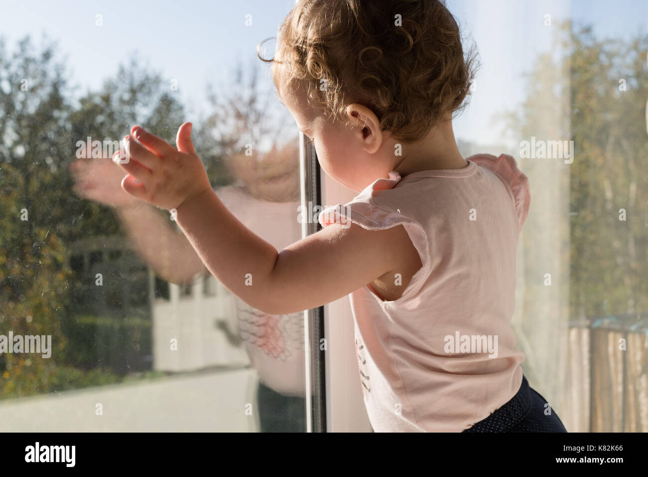 little child by the window Stock Photo - Alamy