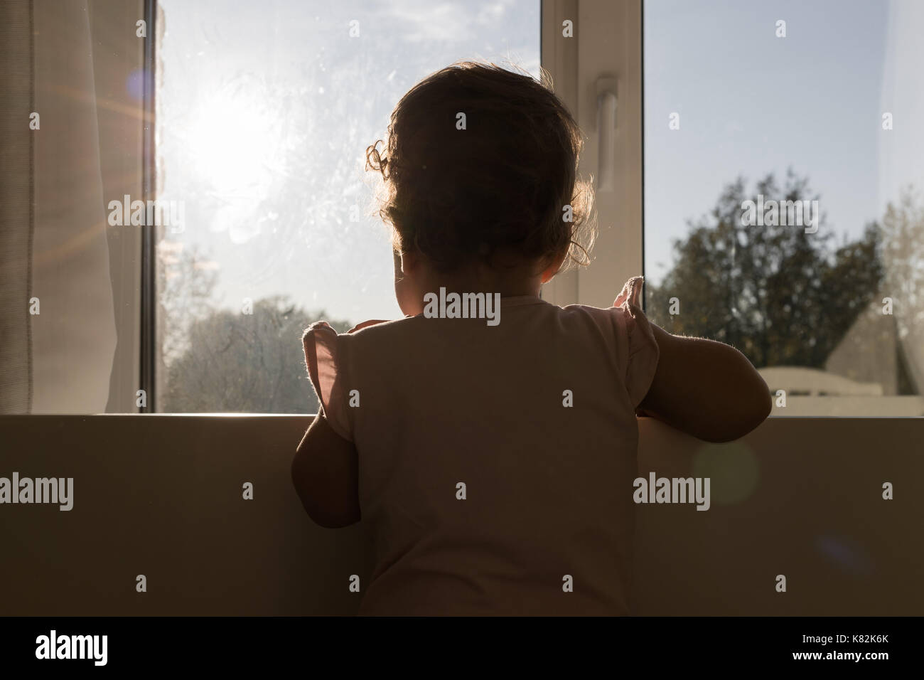 little child by the window Stock Photo - Alamy