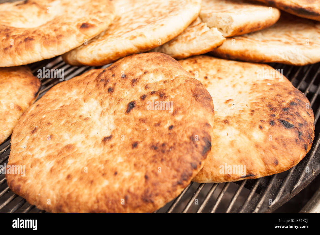 Pita, Arabic bread, soft baked flatbreads on grill Stock Photo - Alamy