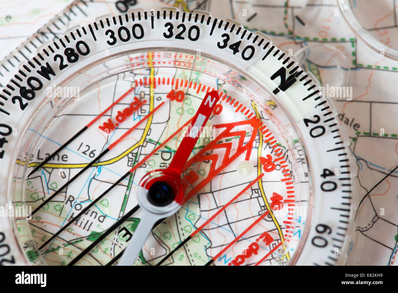 Close up of a map and compass Stock Photo - Alamy