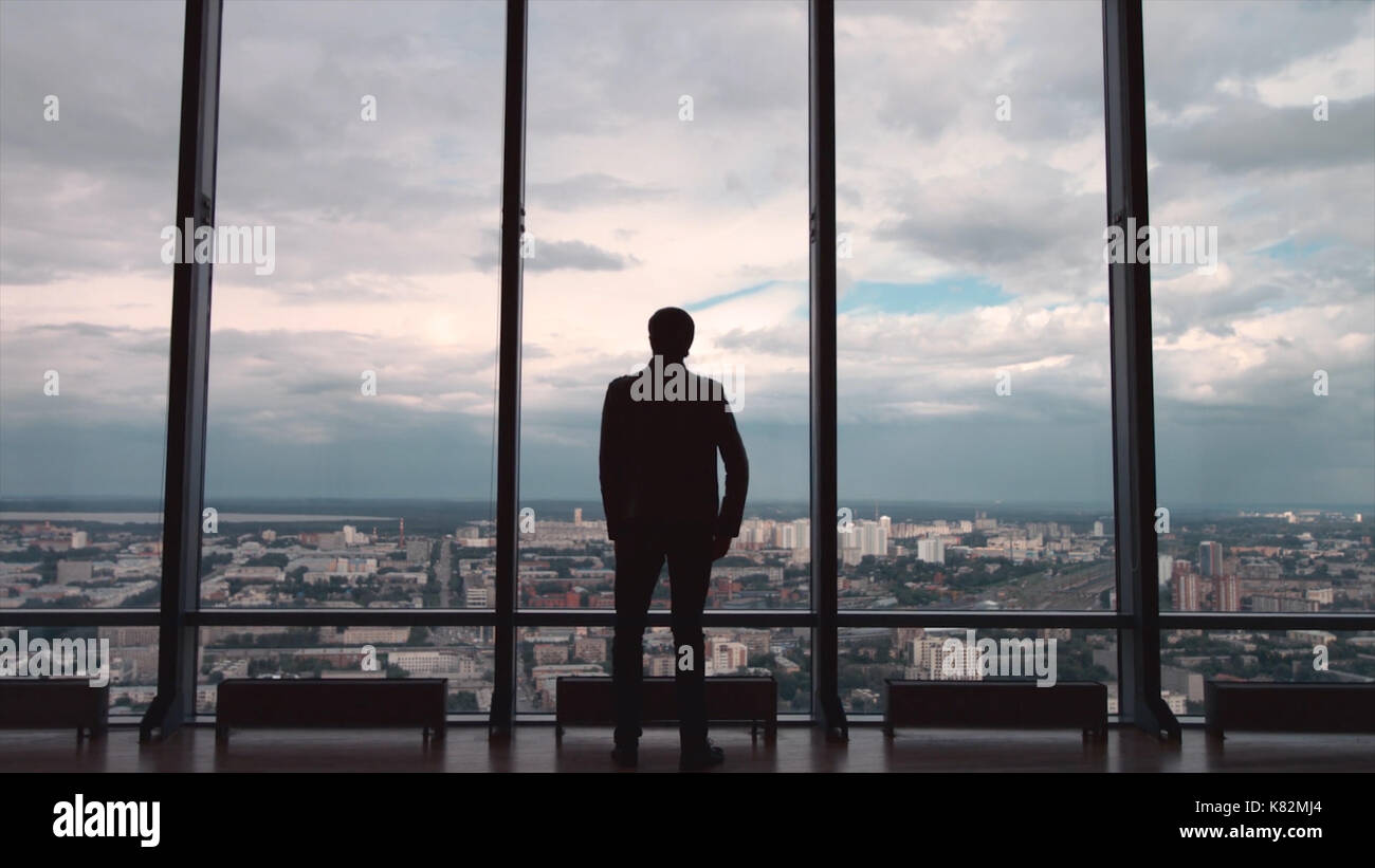 Short man big suit hi-res stock photography and images - Alamy