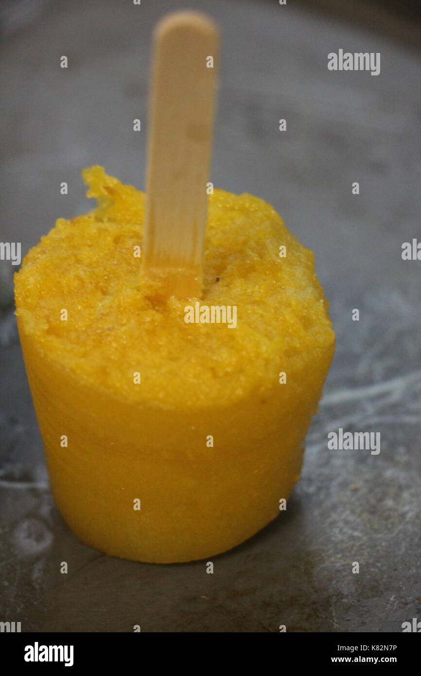 Homemade yellow popsicles Stock Photo - Alamy
