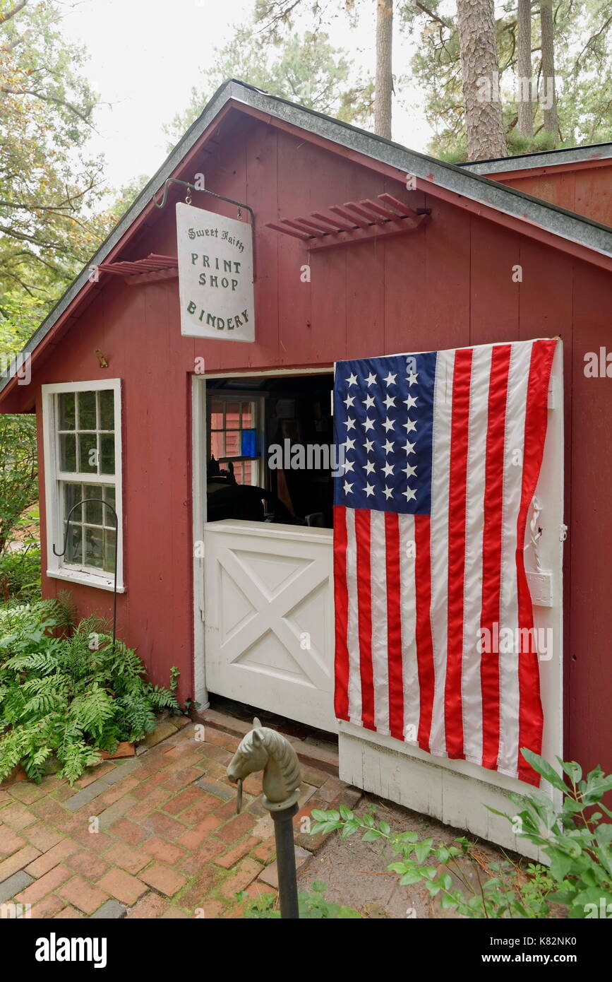 Exterior view of the Print Shop with U.S. flag and hitching post at the ...